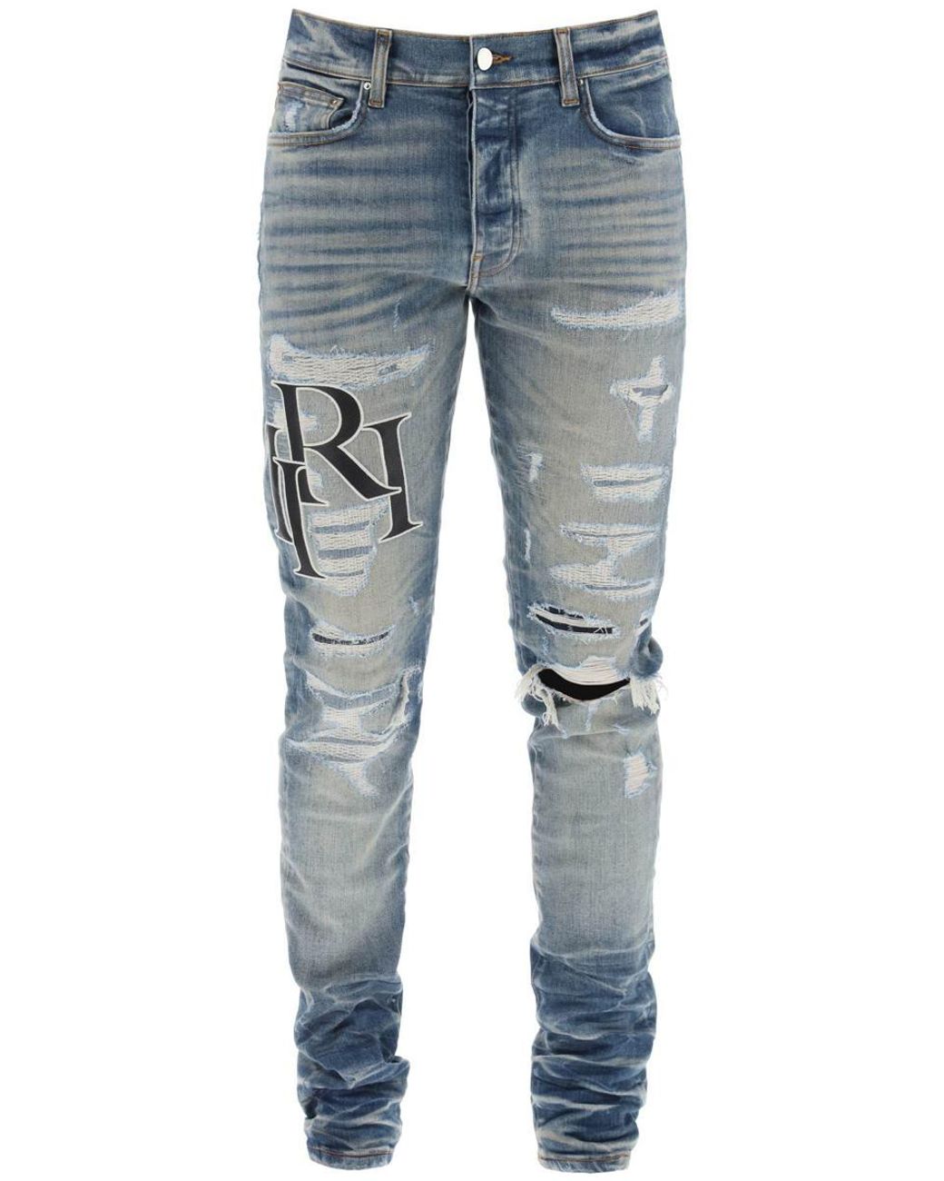 Amiri Destroyed Jeans With Staggered Logo in Blue for Men | Lyst