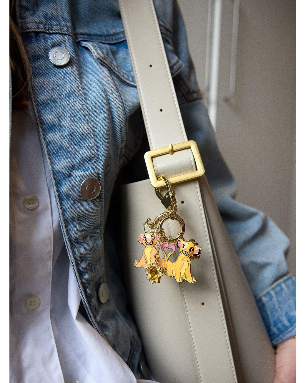 BaubleBar Disney The Lion King Dynamic Duo Bag Charm in Metallic | Lyst