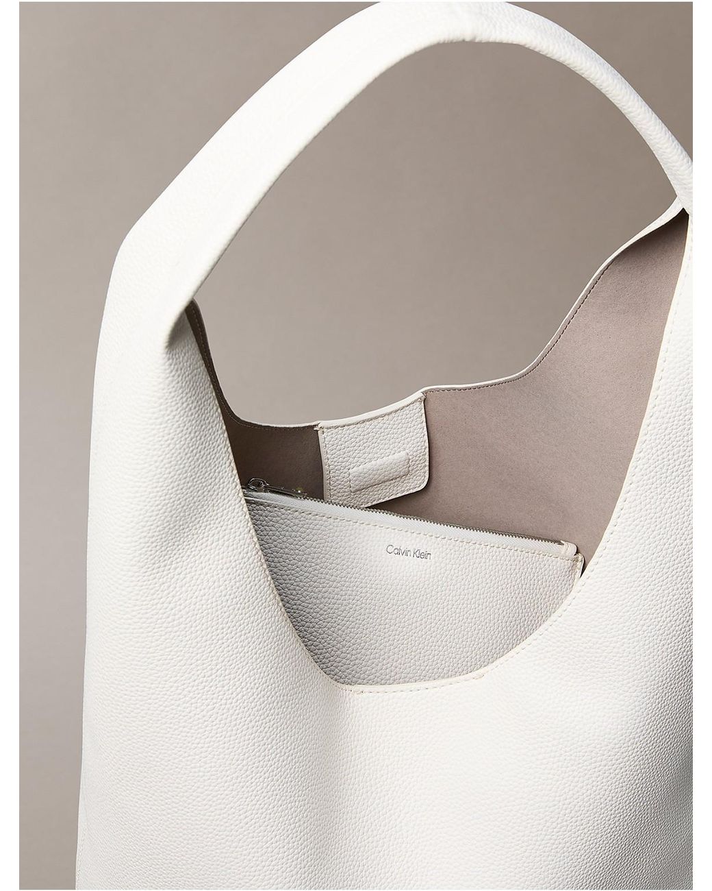 Calvin Klein Pebble Grain Medium Slouchy Bag in Gray | Lyst
