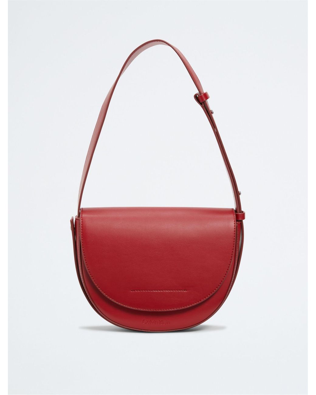 Calvin Klein Elemental Saddle Bag in Red | Lyst