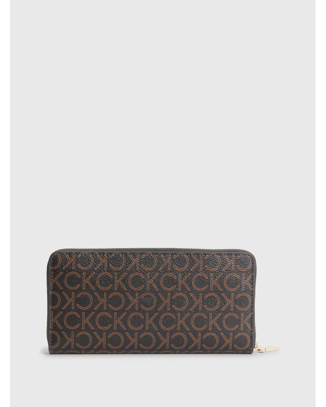 Calvin Klein Monogram Logo Trifold Wallet In Brown Lyst