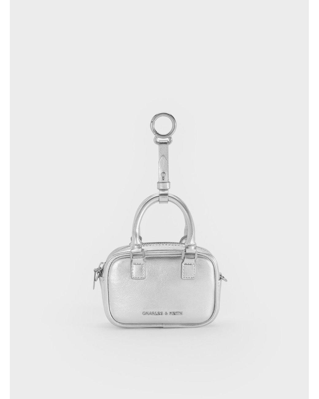 Charles & Keith Sianna Metallic Bag Charm in White | Lyst