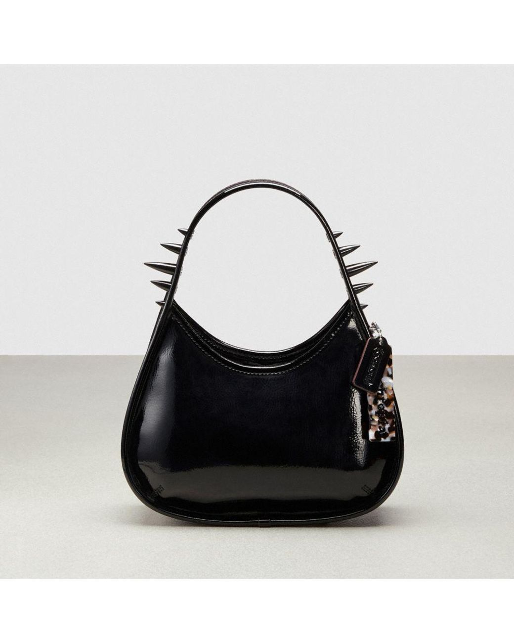 COACH Ergo Bag In Crinkle Patent Topia Leather Spikes in Black | Lyst