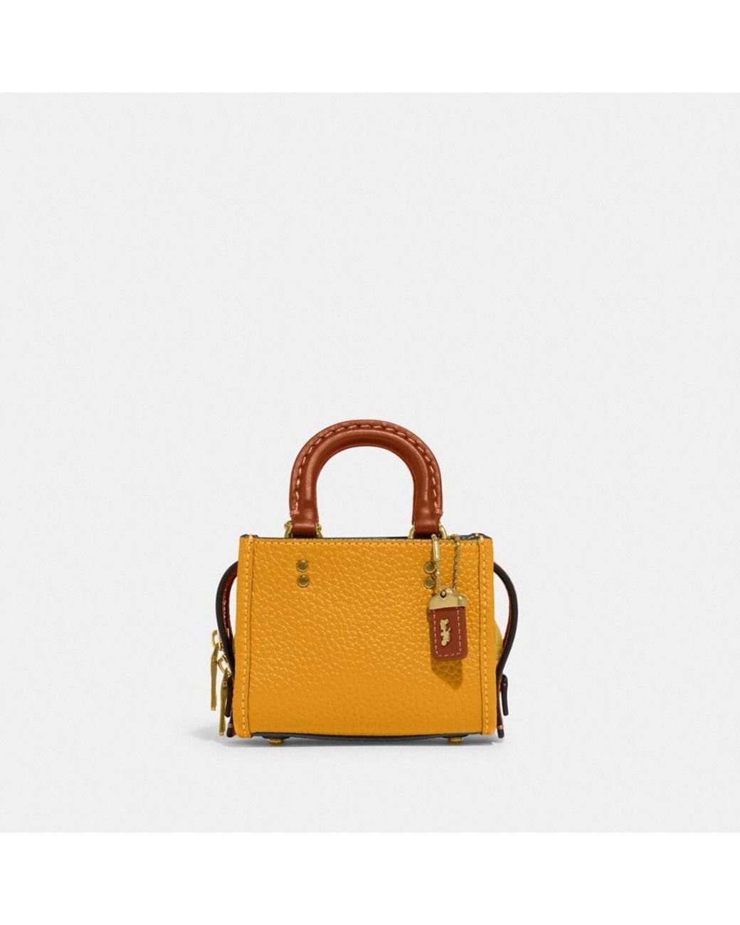 COACH Rogue 12 In Colorblock Regenerative Leather in Orange | Lyst
