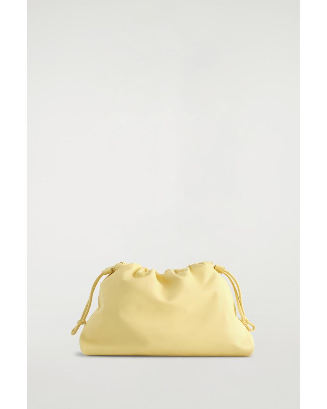 COS Mini Cavatelli Clutch Bag in Yellow | Lyst