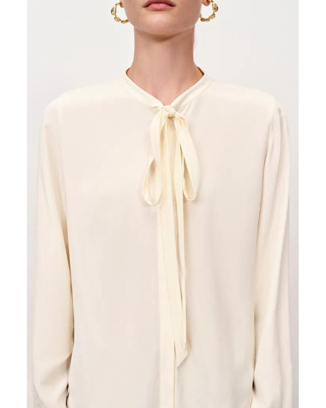 Fabrique Linde Ribbon Tie Flowy Blouse in Natural | Lyst UK