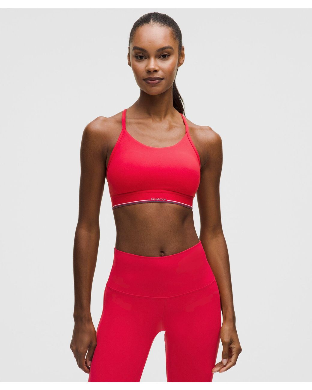 lululemon Flow Y Mid-Support Bra Logo in Red | Lyst
