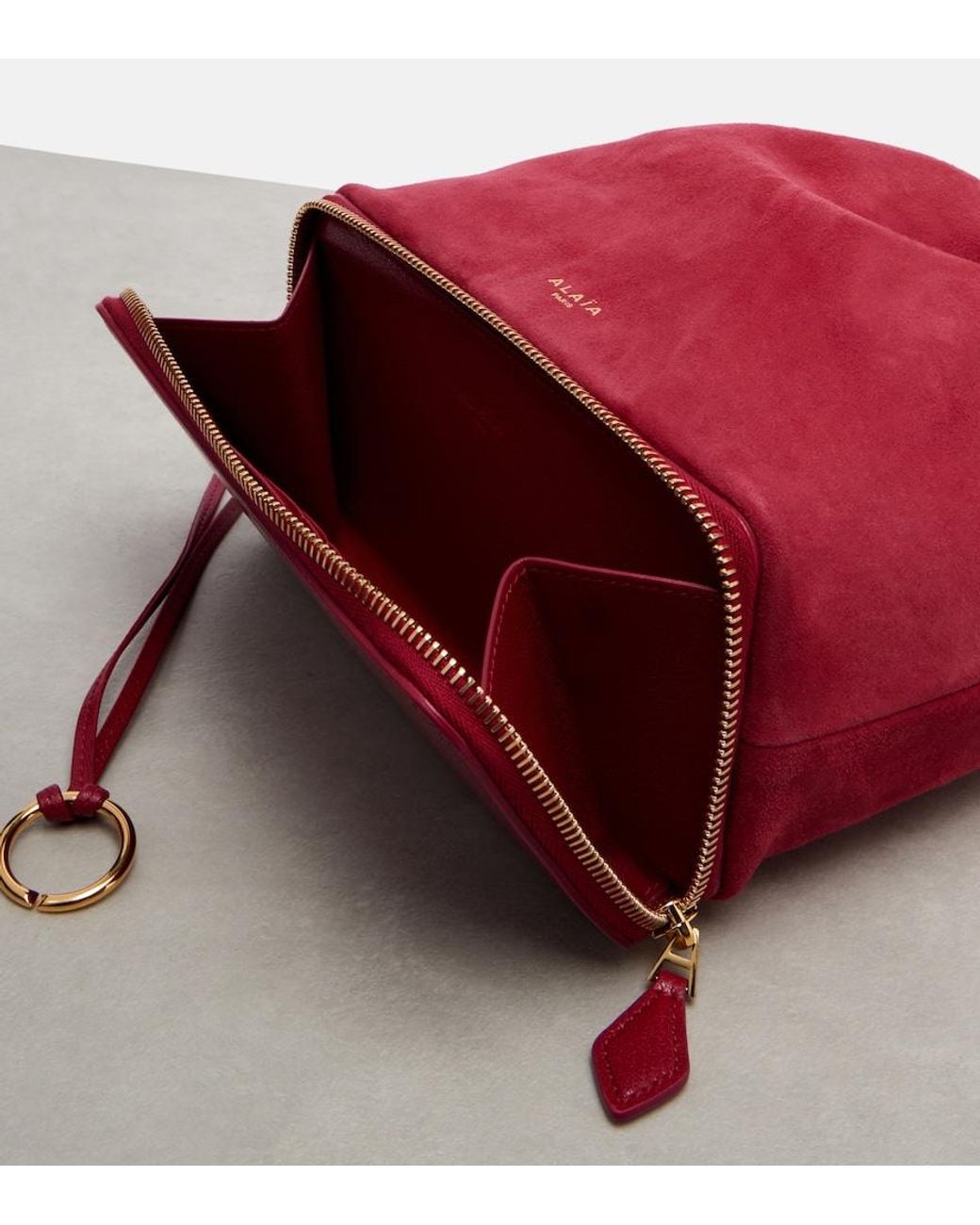 Alaïa Le Pochon Suede Bucket Bag in Red | Lyst