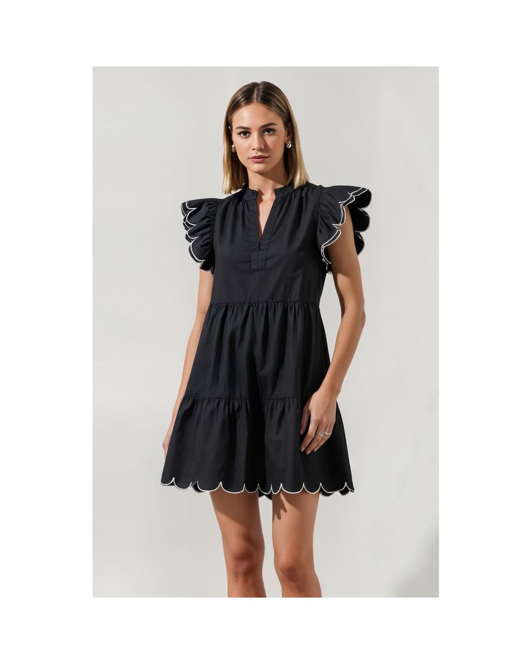 Modenaire Tiered Mini Dress With Scalloped Trim And Ruffled Sleeves in ...