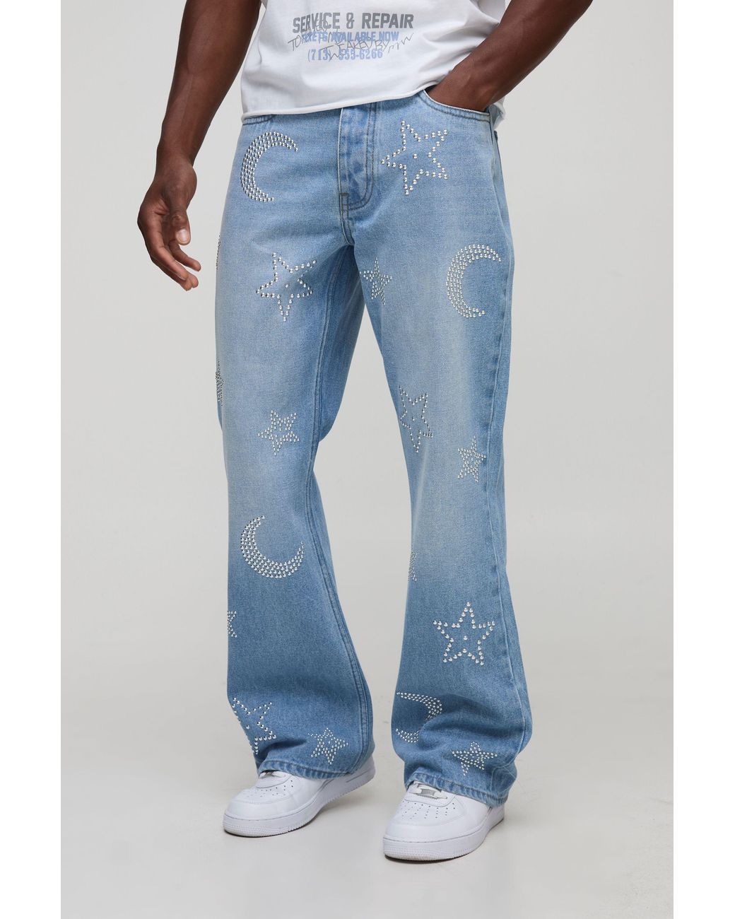 BoohooMAN Relaxed Flared Washed Star Studded Jeans in Blue for Men ...