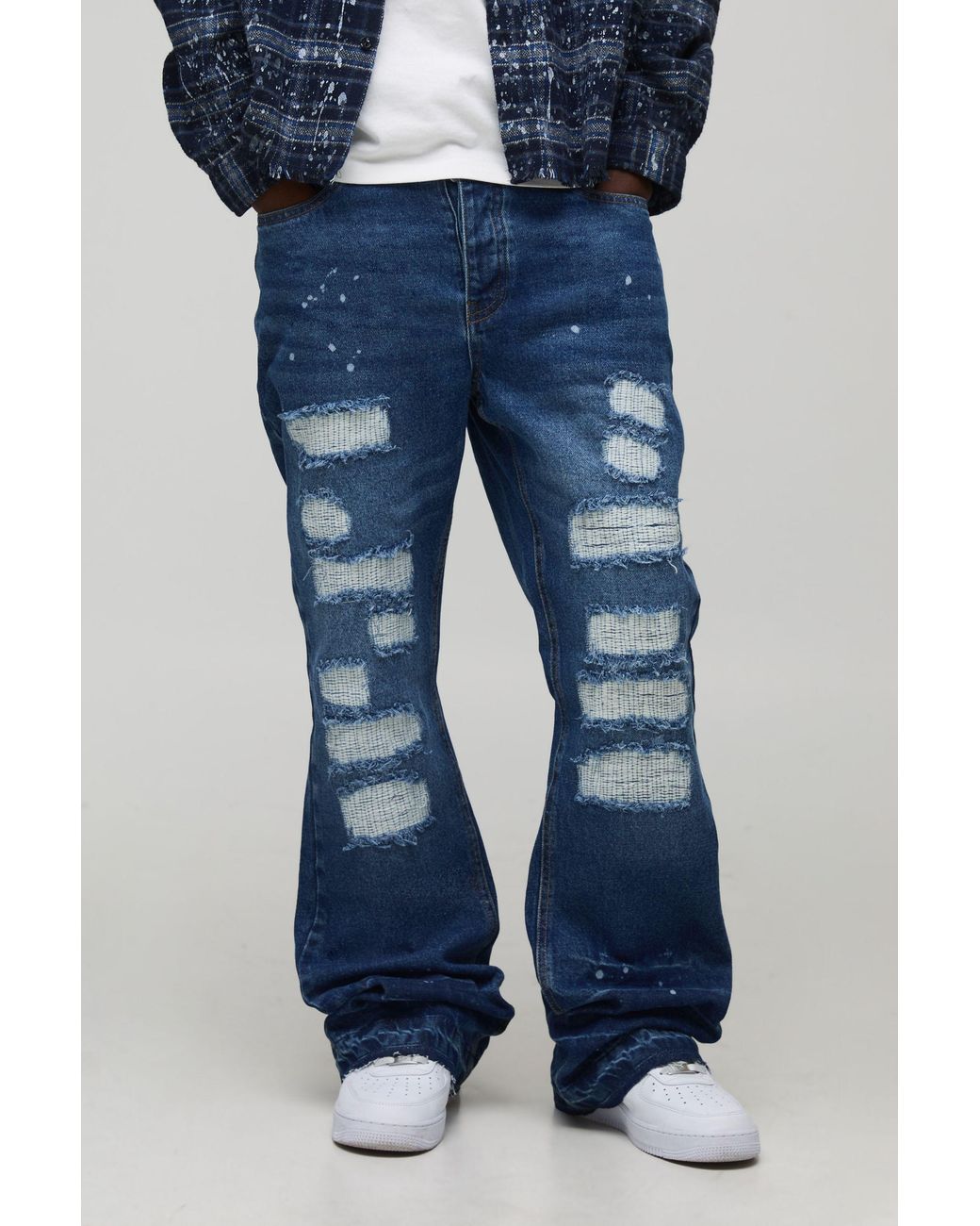 BoohooMAN Straight Flared Stacked Stitch Ripped Detail Jeans in Blue ...