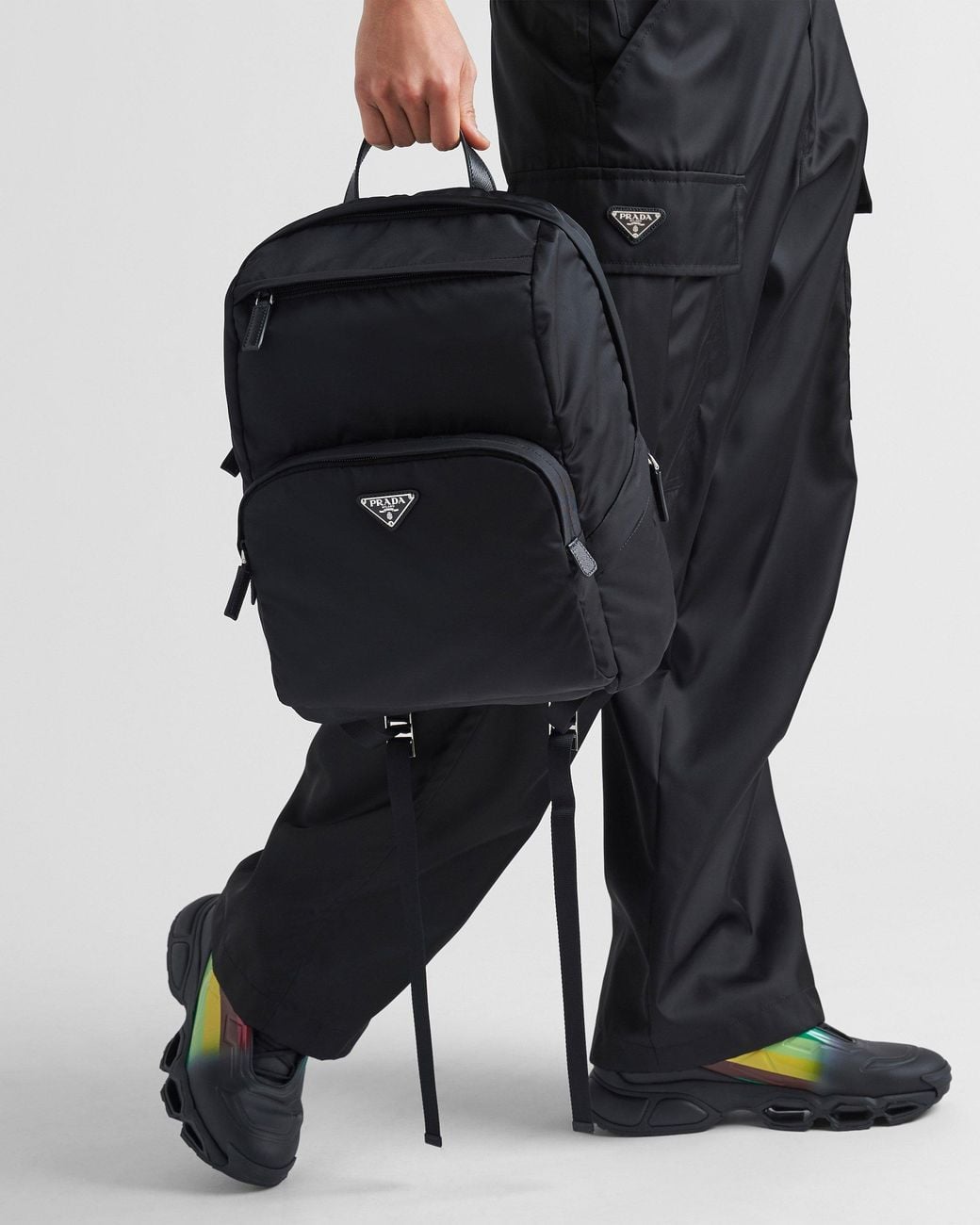Prada Triangle Logo Plaque Backpack in Black for Men | Lyst