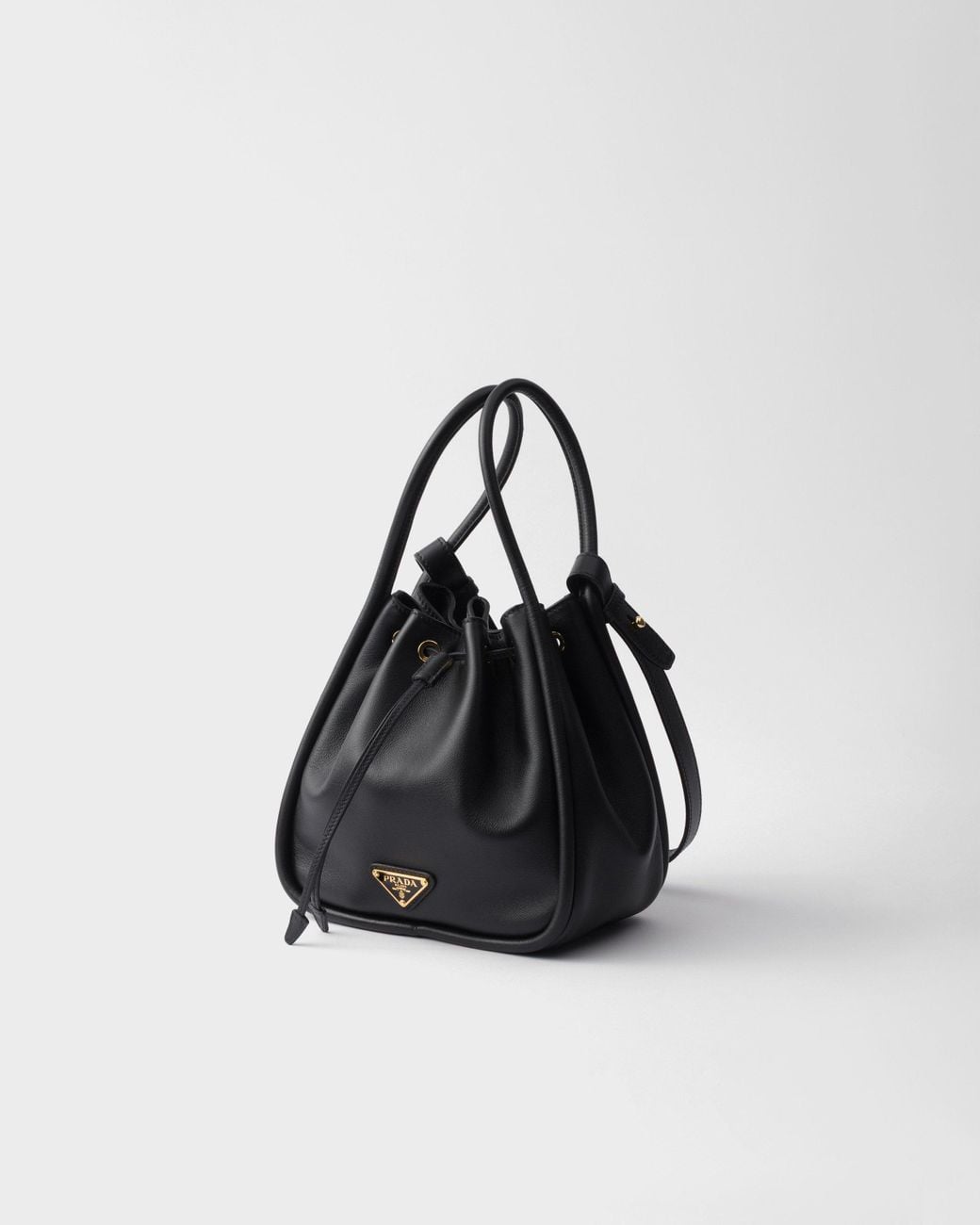 Prada Triangle-Logo Drawstring Bucket Bag in Black | Lyst
