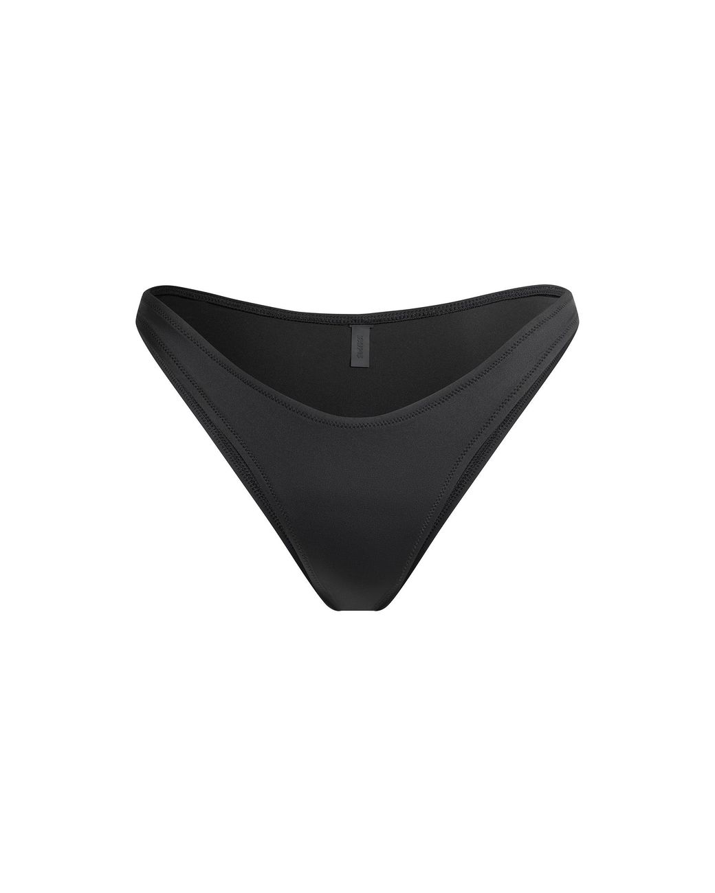Skims Tanga Bikini Bottom in Black | Lyst