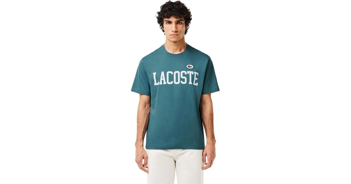 Lacoste Short Sleeve Classic Fit Tee Shirt W/ Large Wording (Hydro) T ...
