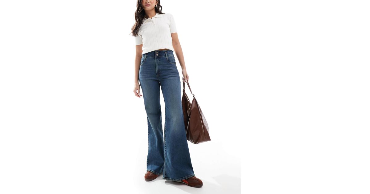 Levi's Ribcage Bells High Rise Flare Jeans With Corset Detail in Blue | Lyst