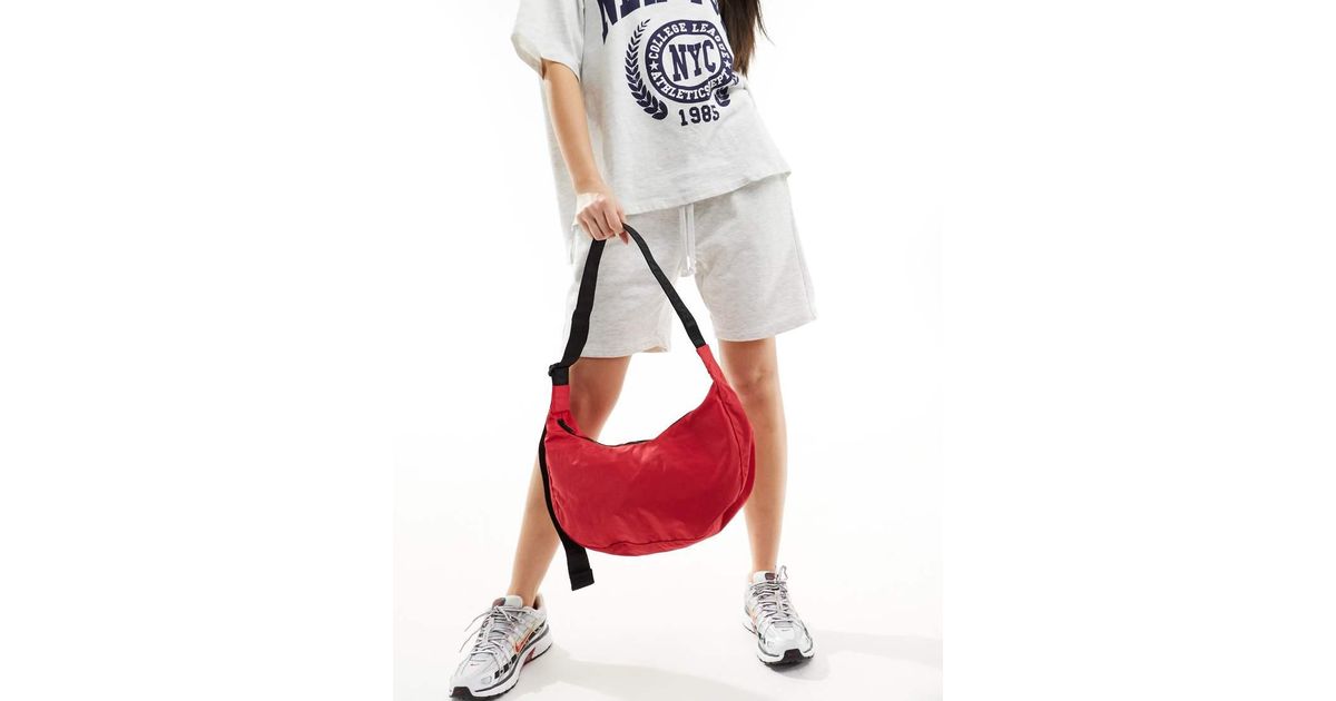 BAGGU Medium Nylon Crescent Crossbody Bag in Red | Lyst UK