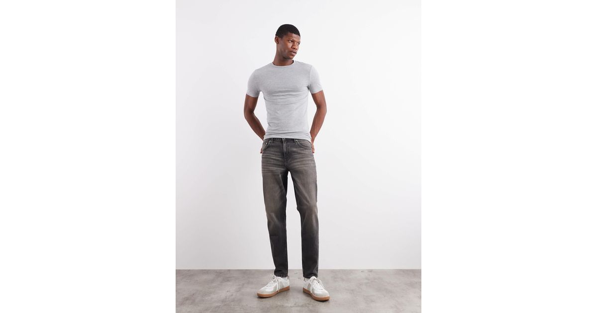 ASOS Tapered Fit Jeans With Yellow Tint in White for Men | Lyst