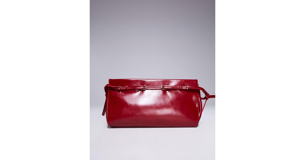 ASOS Clutch Bag With Skinny Buckle Strap Detail in Red | Lyst