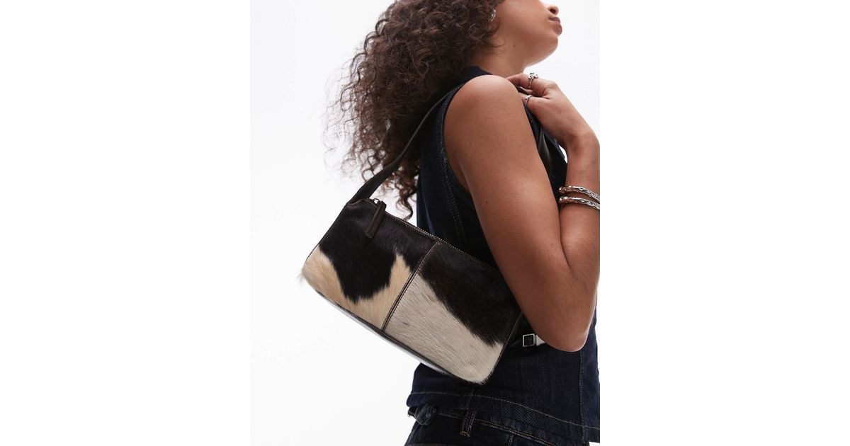 Mango Cow Print Leather Shoulder Bag in Black | Lyst