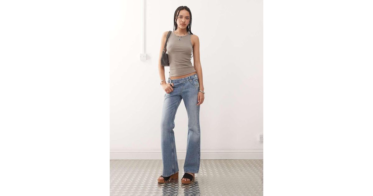 Weekday Low Waist Flare Jeans With Side Button Western Detail in Blue ...