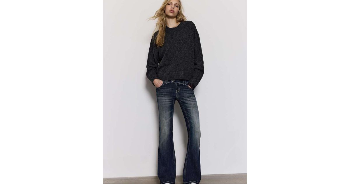 Stradivarius Embroidered Pocket Bell Bottom Jeans in Blue | Lyst UK