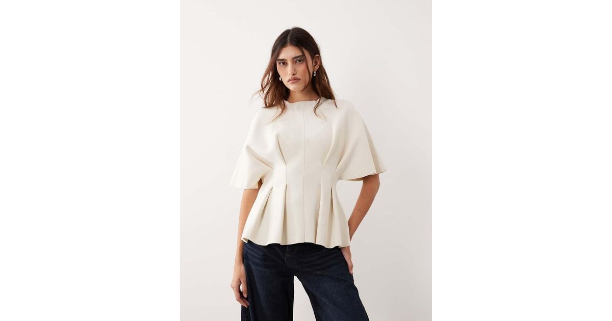 ARRANGE Knit Short Sleeve Cinched Pleated Top in Natural | Lyst UK