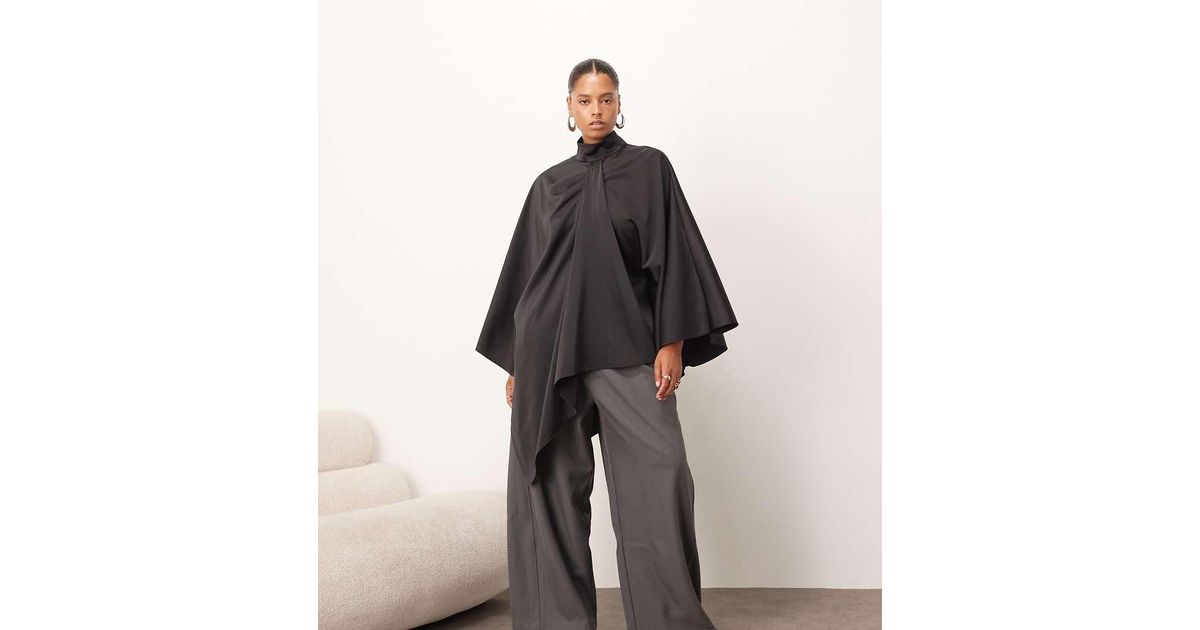 ARRANGE Curve High Neck Drape Cape Top in Black | Lyst UK