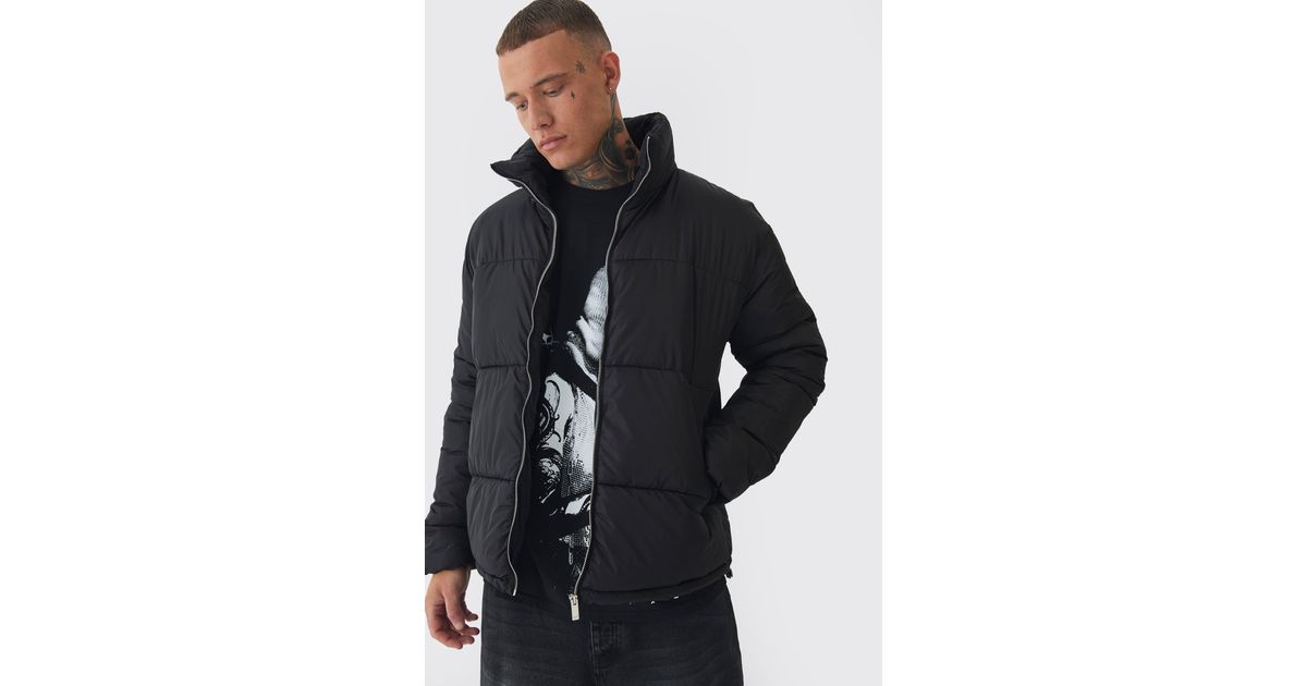 BoohooMAN Tall Worldwide Applique Funnel Neck Puffer Jacket In Black in ...