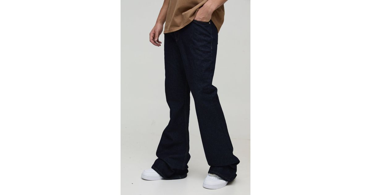 BoohooMAN Relaxed Stacked Flared Rigid Raw Indigo Jeans in Blue for Men ...