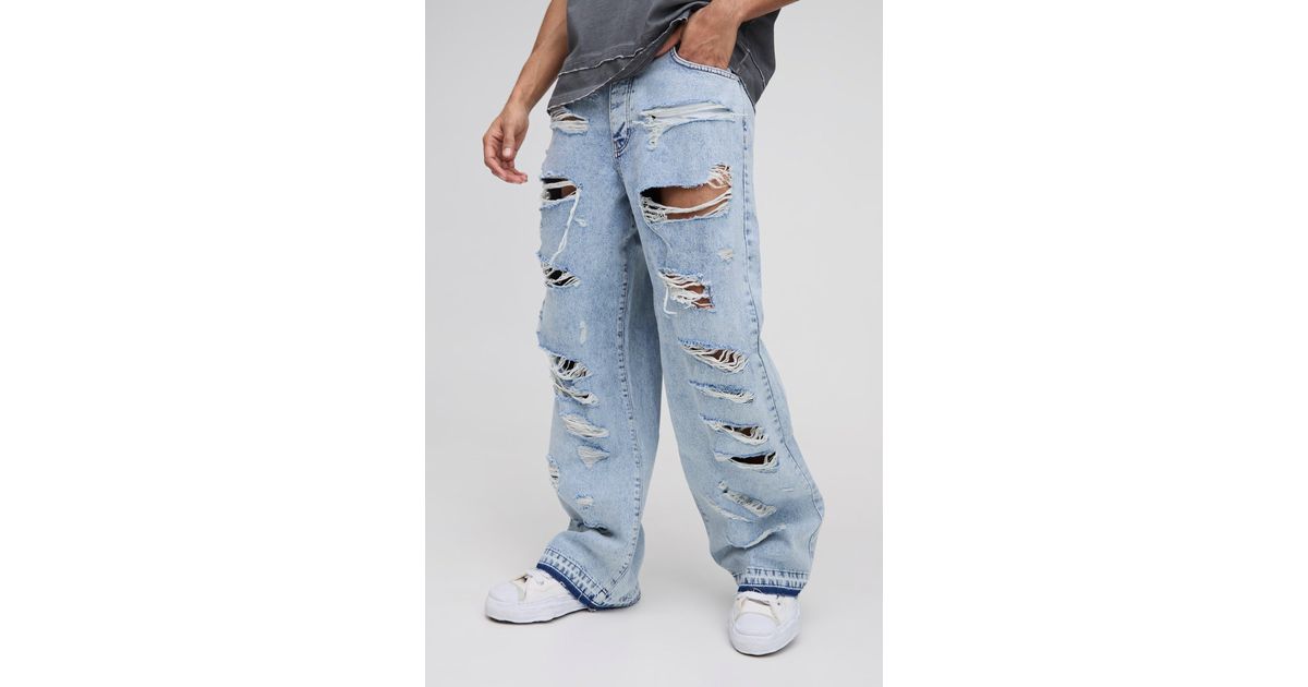 BoohooMAN Wide Leg Skater All Over Ripped Distressed Jeans in Blue for ...