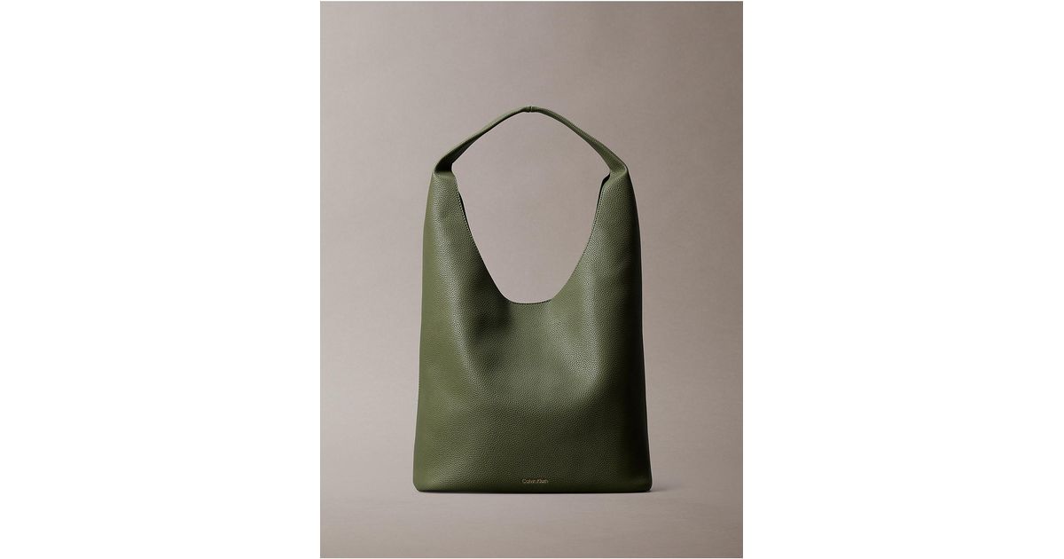 Calvin Klein Pebble Grain Medium Slouchy Bag in Green | Lyst