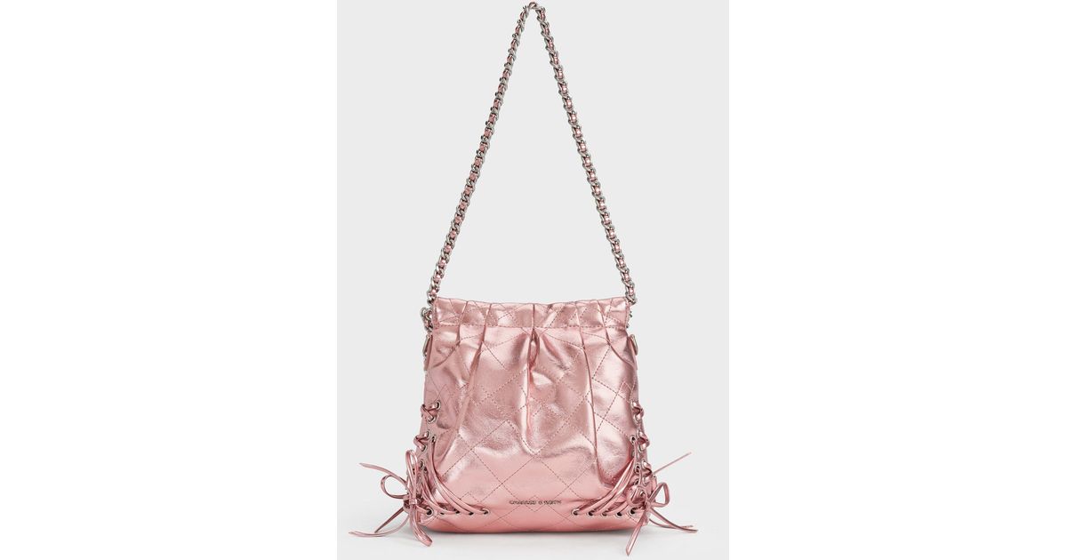 Charles & Keith Duo Metallic Grommet Chain-Handle Two-Way Backpack in ...