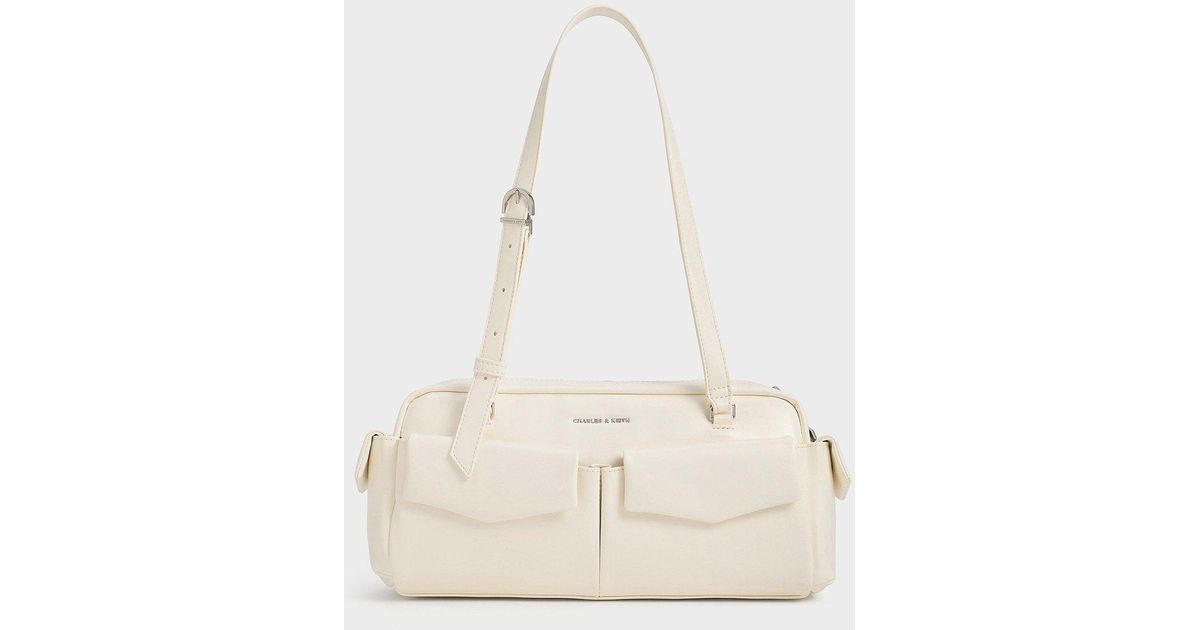 Charles & Keith Rachel Elongated Multi-Pocket Shoulder Bag in Natural ...