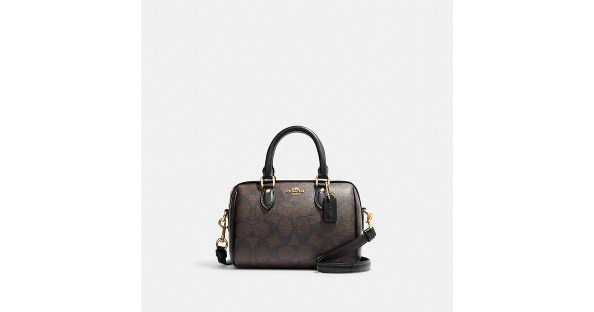 : Mini sac bandoulière Rowan en toile exclusive COACH en coloris Noir ...