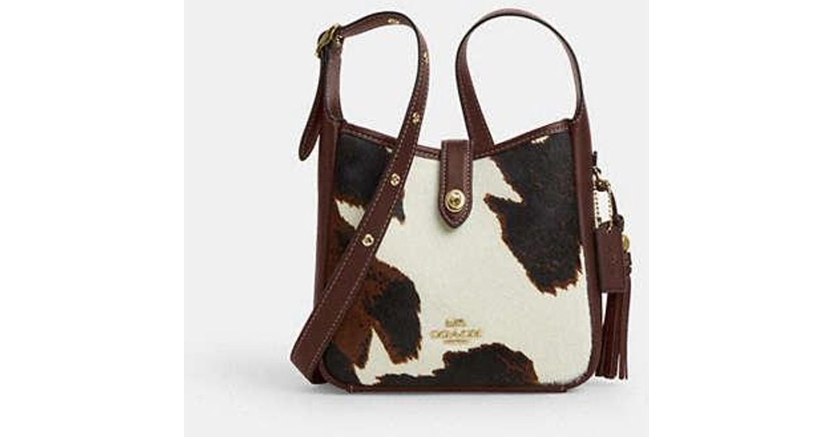 COACH Hadley Mini Crossbody Bag With Cow Print And Tassel in Black ...
