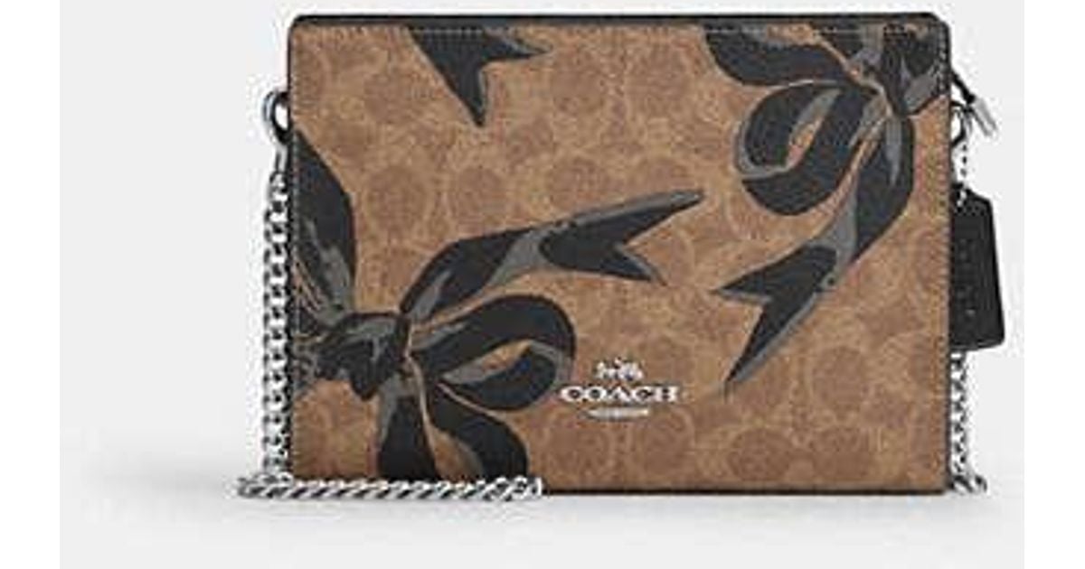 COACH Slim Crossbody Bag In Signature Canvas With Bow Print in Black | Lyst