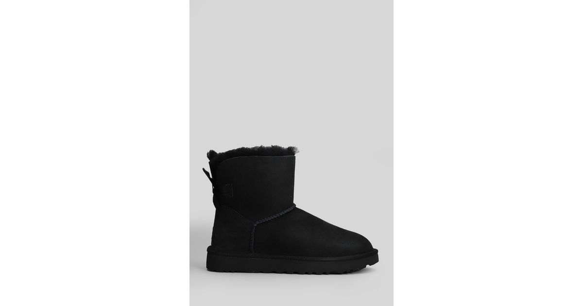UGG Mini Bailey Bow Ii Low Heels Ankle Boots In Black Suede | Lyst