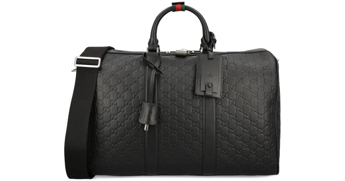 Gucci Medium Gg Emblem Embossed Holdall in Black for Men | Lyst UK
