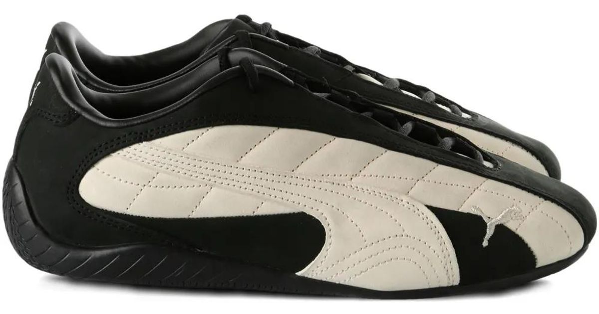 PUMA Logo-Embroidered Sneakers in Black | Lyst