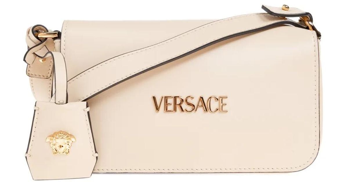 Versace Mini Tag Logo Charm Crossbody Bag in Natural | Lyst UK