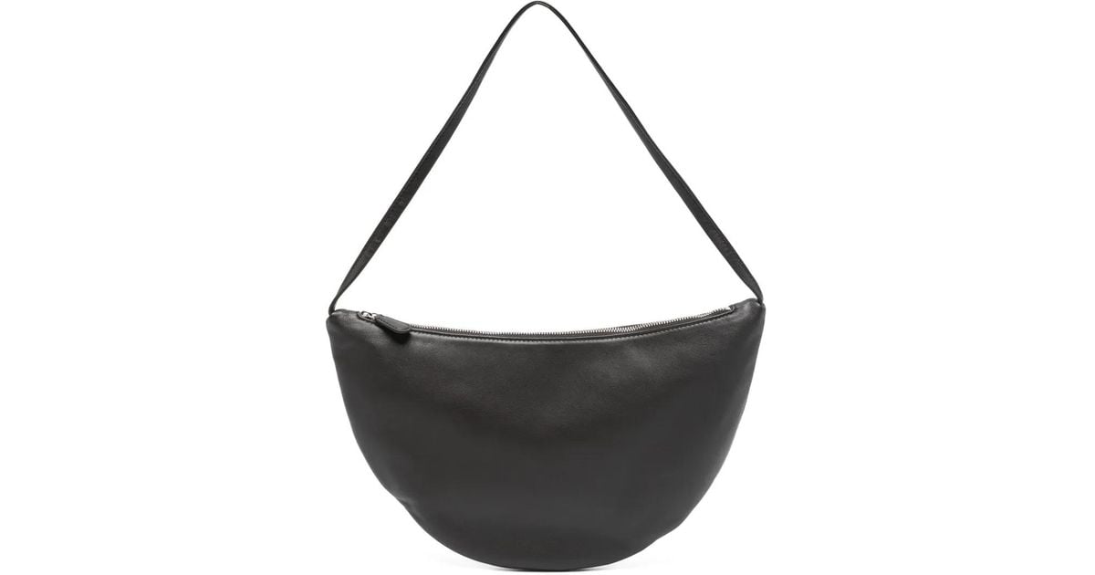 The Row Lambskin Izzy Small Crossbody Bag in Black | Lyst