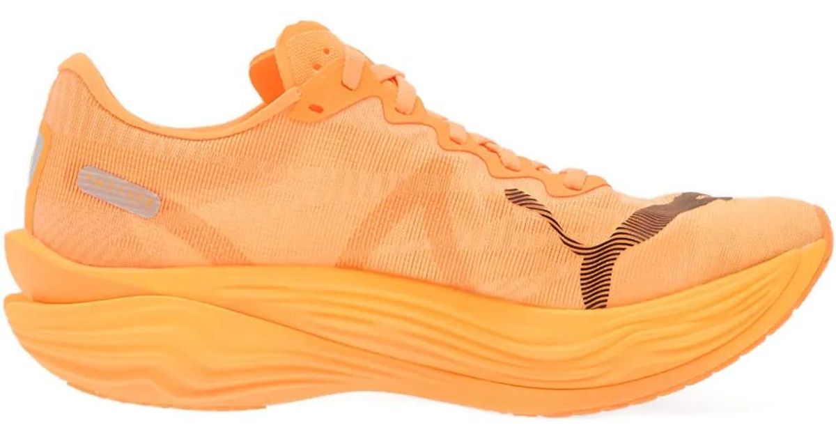 PUMA Deviate Elite 3 Sneakers in Orange for Men | Lyst UK