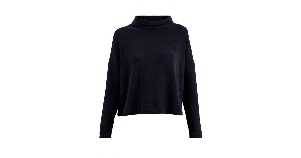 Mama B. Roll Neck Asymmetric Hem Knit in Blue | Lyst UK