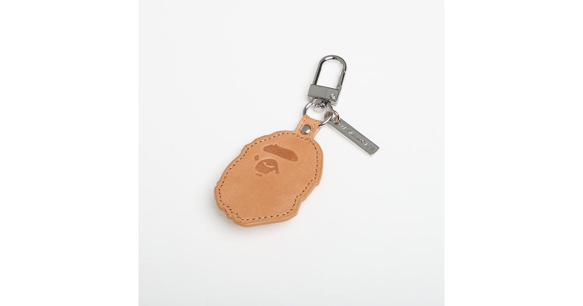 A Bathing Ape Ape Head Leather Keychain in White | Lyst