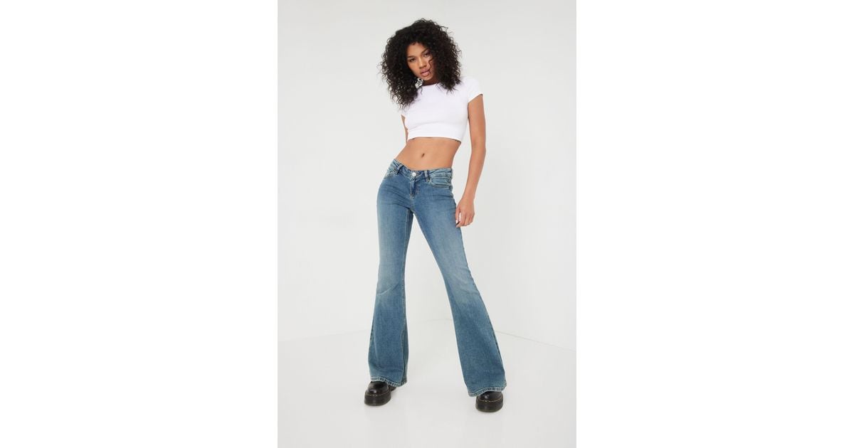 Garage Extreme Low Rise Flare Jean in Blue | Lyst