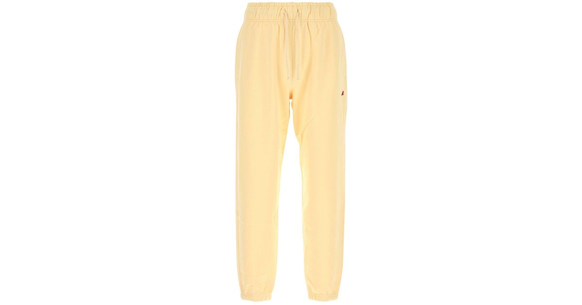 New Balance Pastel Yellow Cotton joggers for Men | Lyst UK