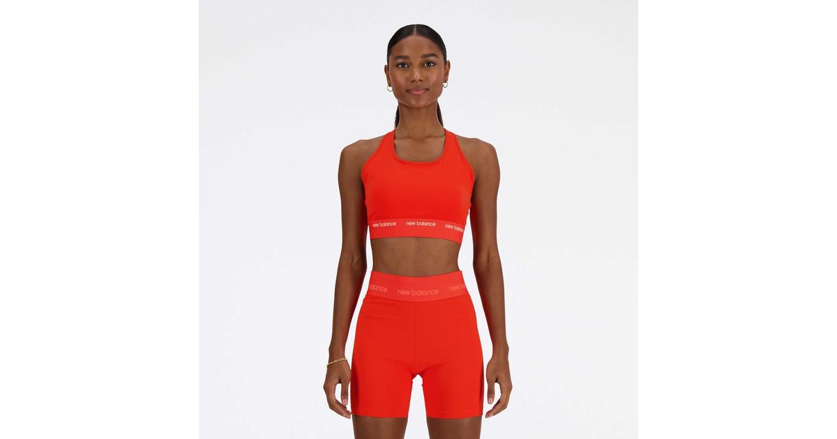 New Balance Sleek Medium Support Sports Bra in Red | Lyst UK