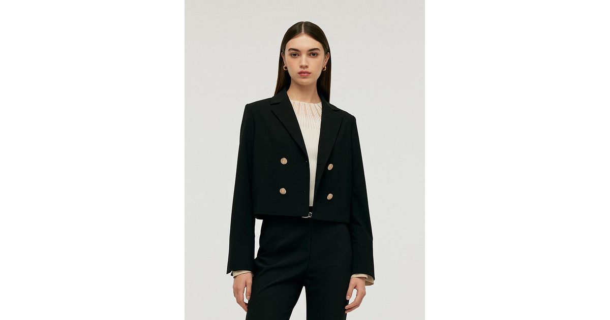 GOELIA Worsted Woolen Crop Blazer With Detachable Sleeve in Black | Lyst