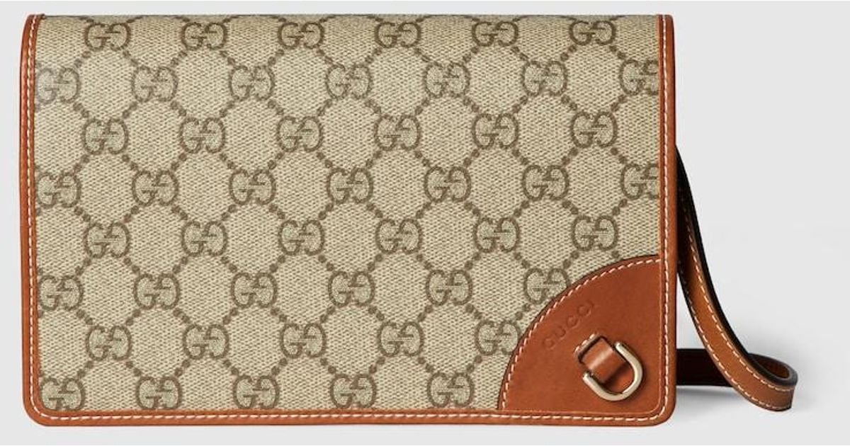 Gucci Gg Emblem Wallet With Leather Strap in Metallic | Lyst